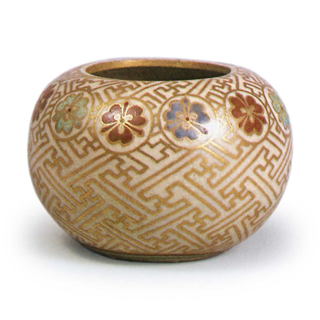 Ninsei: tea caddy with design of ken-katabami crests against fret ...